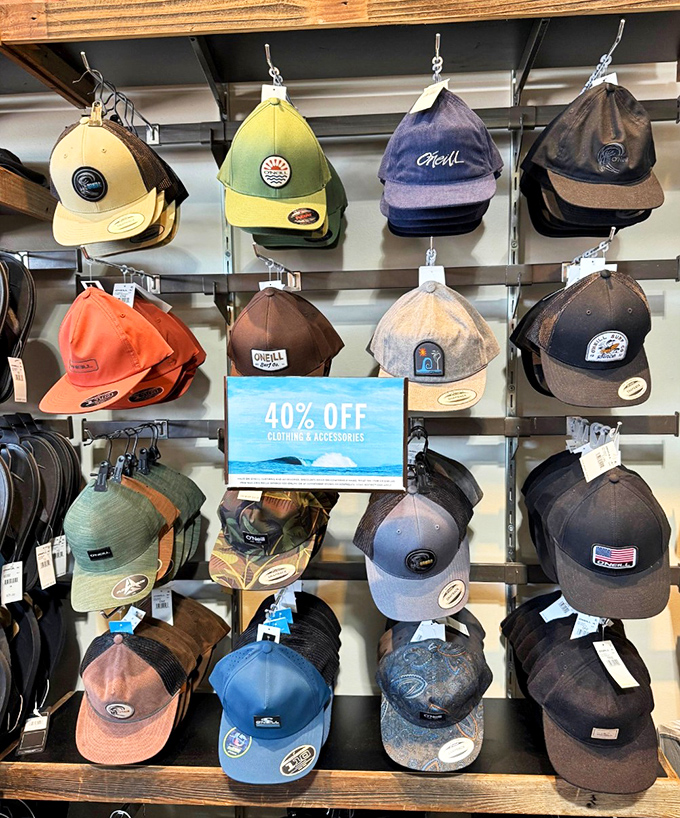 A wall of caps at 40% off&mdash;because nothing says "I'm fiscally responsible" like buying a hat that shields you from both sun and full retail prices.