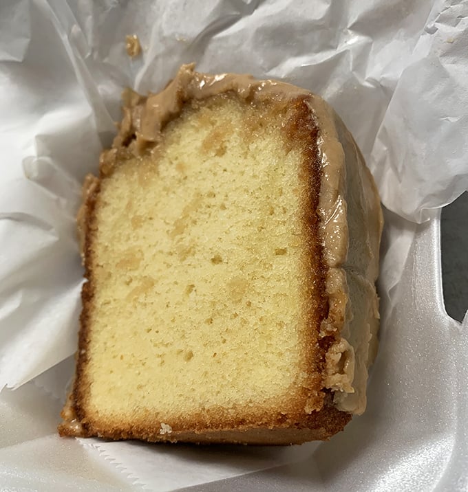 Sweet Southern comfort on a plate: caramel cake that whispers "save room" while your full stomach protests.