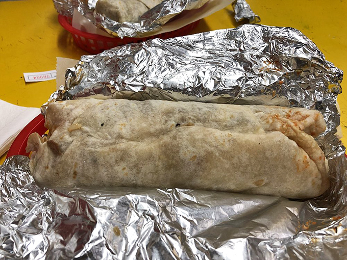 The foil-wrapped treasure reveals itself &ndash; a perfectly constructed burrito torpedo ready to launch your taste buds into orbit.