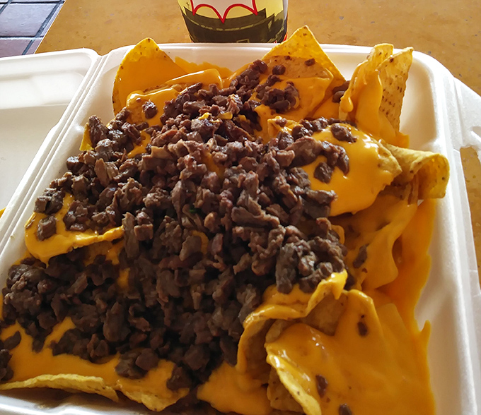 Nachos that laugh at restraint. That cheese-to-meat ratio isn't just generous&mdash;it's downright philanthropic.