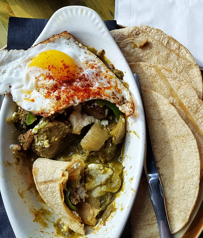 Carnitas Verdes with a perfectly fried egg on top &ndash; the kind of breakfast that makes you wonder why you'd ever settle for cereal again.