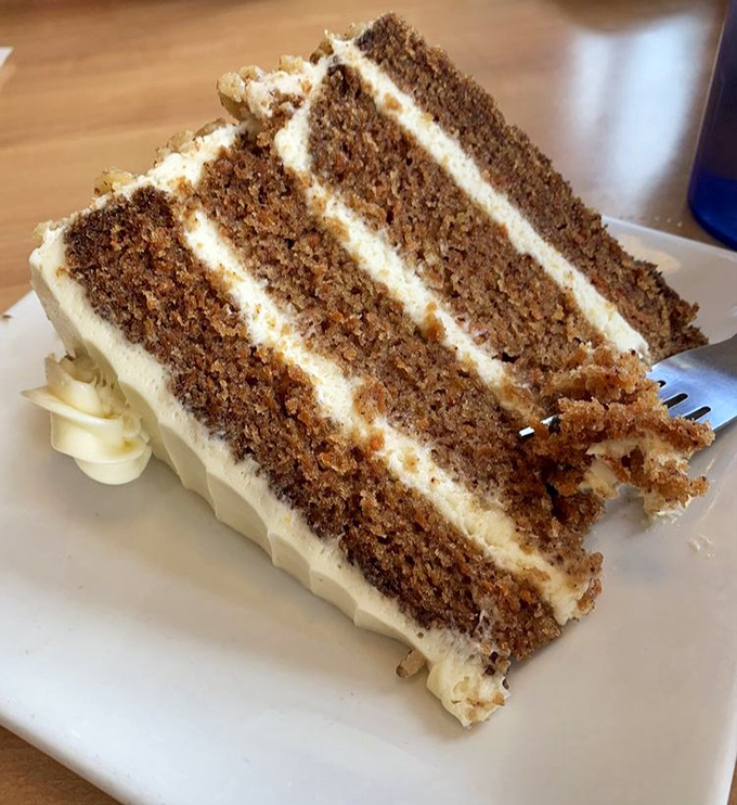 This towering carrot cake slice could feed a small village or one very determined dessert enthusiast.