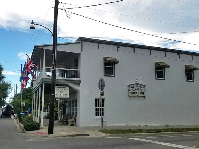 The Historical Society Museum stands as Cedar Key's memory keeper, where flags flutter in the breeze and yesterday's tales find tomorrow's audience.