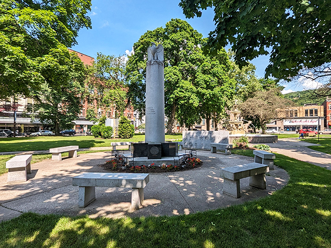Central Park's memorial stands as a quiet sentinel amid downtown greenery. The perfect spot for contemplation, people-watching, or enjoying that sandwich you picked up down the street.