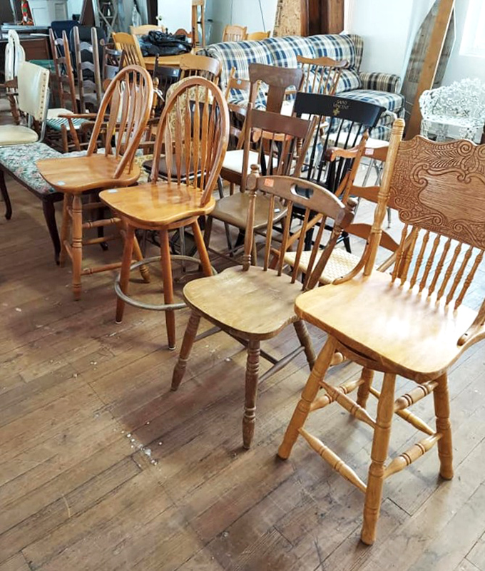 Wooden chairs gather like old friends at a reunion, each with stories from different kitchen tables.