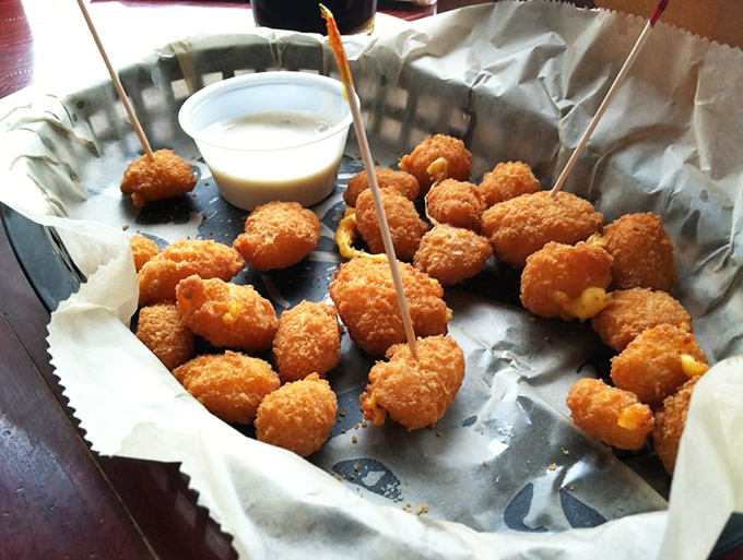 These golden cheese curds aren't just appetizers, they're little Wisconsin ambassadors of joy &ndash; crispy outside, melty inside, and served with a dipping sauce for good measure.