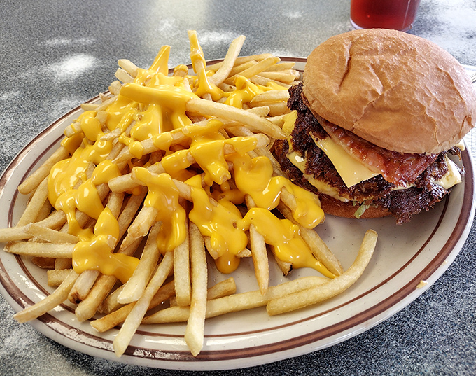 The plate that launched a thousand diets—and ended them just as quickly. Those cheese fries deserve their own zip code.