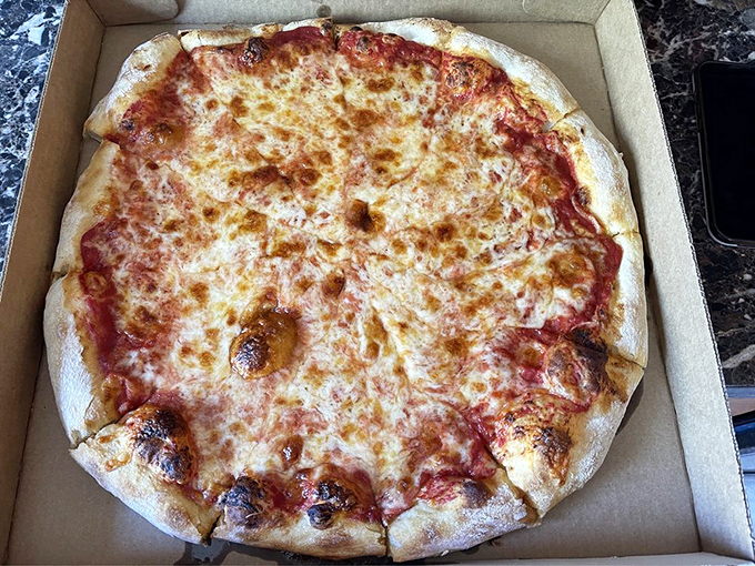 Pizza perfection doesn't need to shout. This cheese pie speaks volumes with its bubbling edges, perfect sauce-to-cheese ratio, and that distinctive Pittsburgh chew.