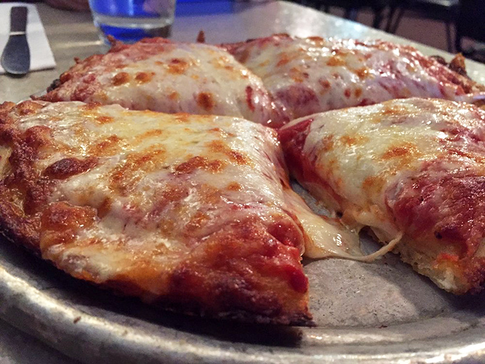 Pizza perfection isn't complicated&mdash;it's this gloriously simple cheese pie with edges that curl up just enough to create those magical little oil reservoirs.