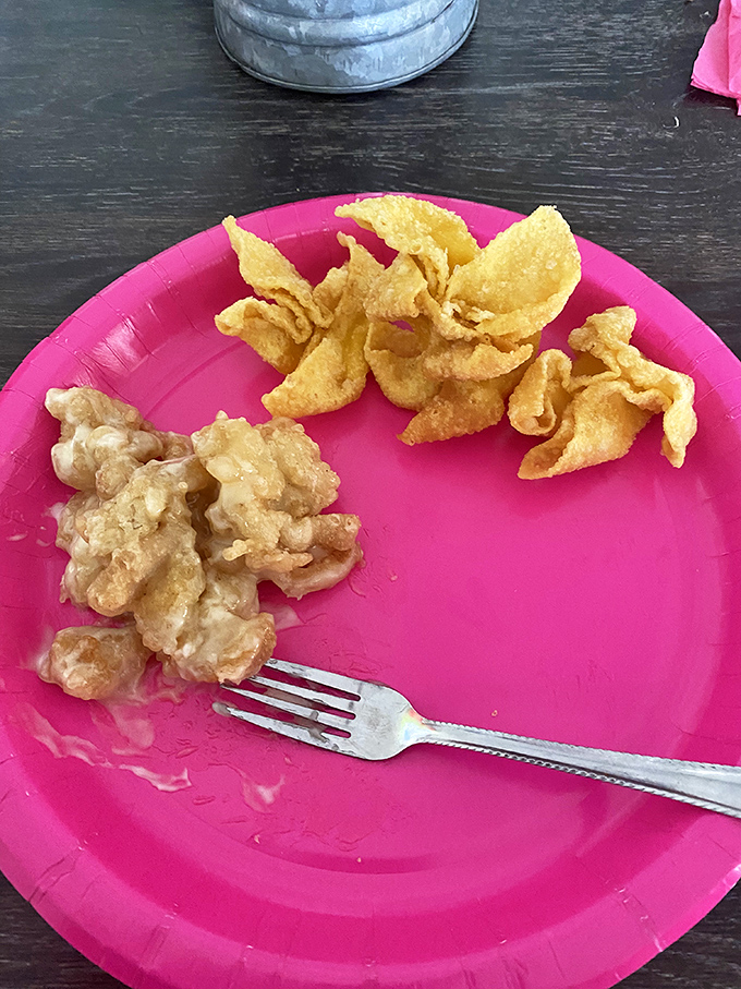 Golden-fried wontons and crunchy chips on a no-nonsense pink plate. Sometimes the simplest presentations deliver the most satisfying flavors