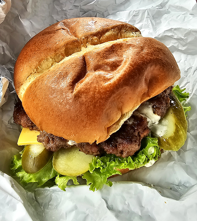 This cheeseburger means business, stacked high with all the fixings that make American comfort food absolutely irresistible.