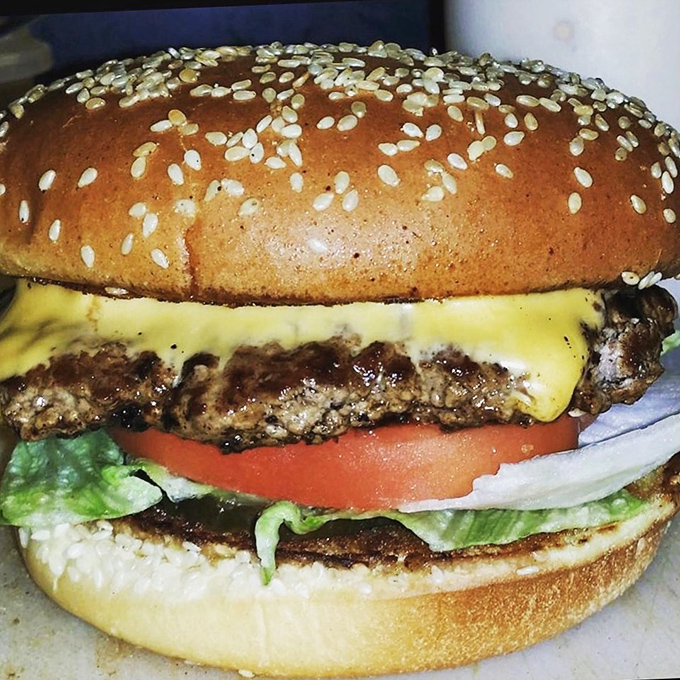 A proper Indiana burger doesn't need fancy tricks – just a perfectly seared patty, melty cheese, fresh veggies, and a sesame bun that means business.