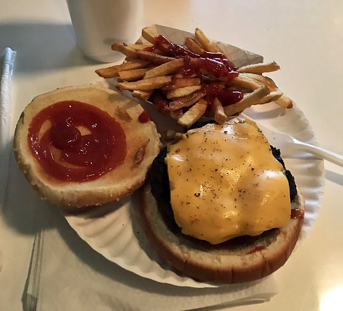 The burger that launched a thousand road trips: perfectly melted cheese, a juicy patty, and the kind of simplicity that's become revolutionary in our overcomplicated world.