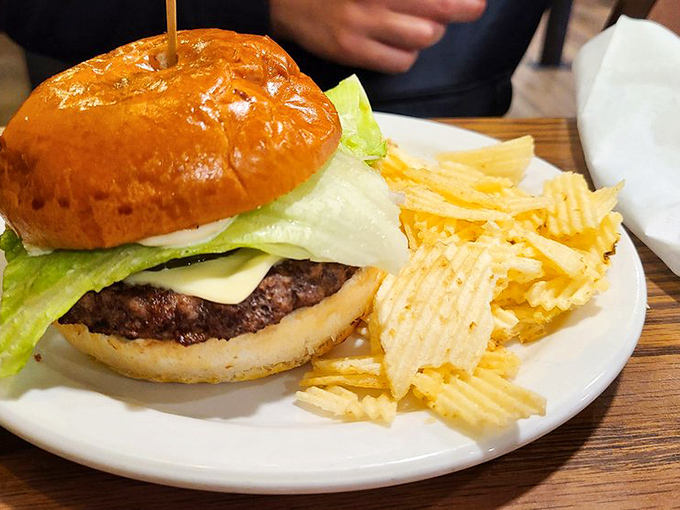 A proper diner burger doesn't need fancy aioli or artisanal buns&mdash;just honest beef, fresh toppings, and those perfectly ridged potato chips standing at attention.