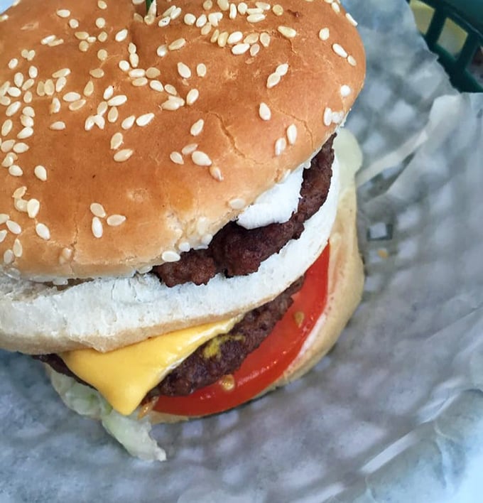 This isn't some fancy gastropub's "deconstructed burger experience"&mdash;it's the real deal, where sesame seeds and melty cheese create timeless magic.