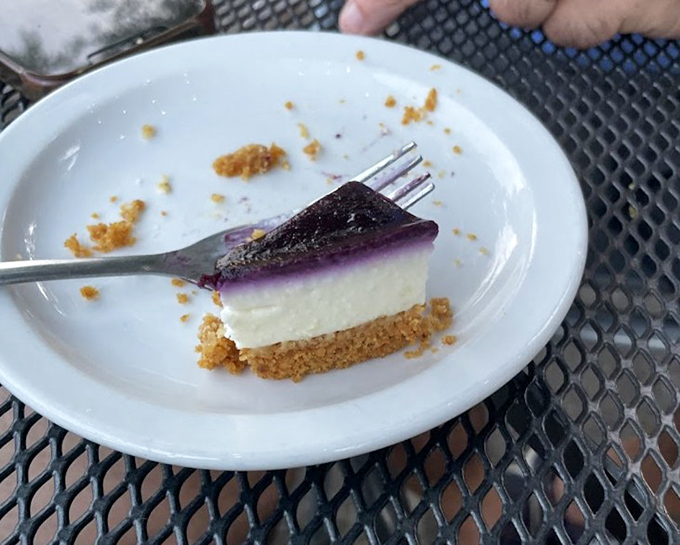 This isn't just cheesecake&mdash;it's a purple-topped revelation with three distinct layers that somehow manages to be both cloud-light and deeply satisfying.