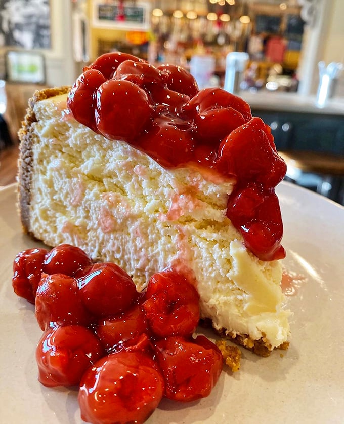 This isn't just cheesecake; it's a creamy canvas topped with ruby-red cherries that would make Grandma both proud and a little jealous.