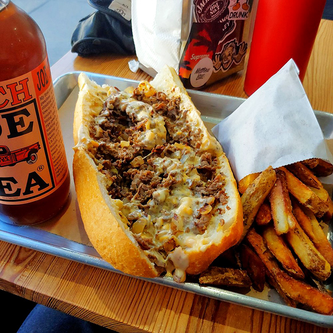 When a cheesesteak and fries arrive on a metal tray, you know you're about to experience Philadelphia in its most honest form.