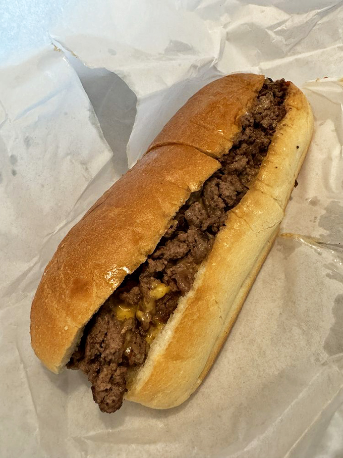 This cheesesteak doesn't need Philadelphia's approval. The golden-brown roll cradles perfectly seasoned beef in a no-frills masterpiece.