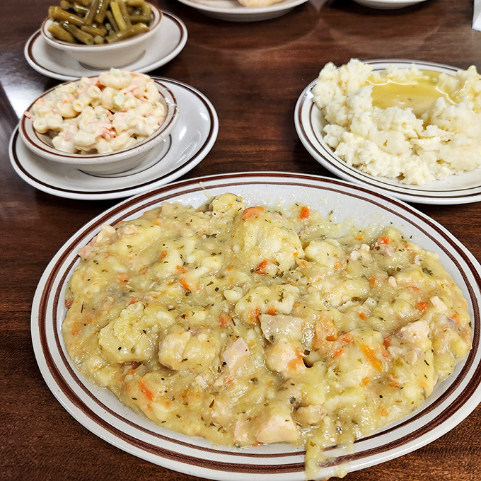 Not soup, not stew, but something gloriously in between. Each spoonful of chicken and dumplings delivers a warm embrace from grandma's kitchen.