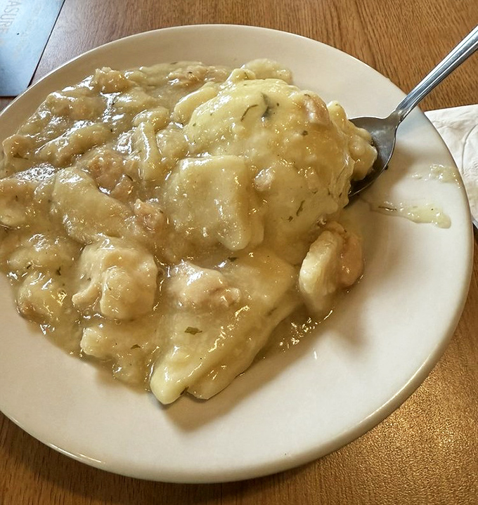 Chicken and dumplings swimming in gravy that your grandmother would approve of. This isn't just comfort food—it's a warm hug on a plate.