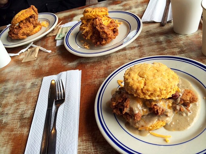 These aren't just biscuit sandwiches; they're architectural marvels of comfort food, where every layer tells a delicious story.