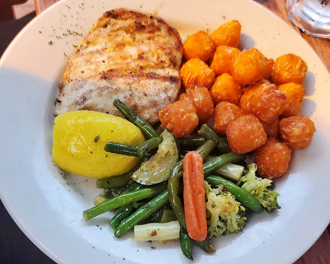 Simple perfection: tender chicken, sweet potato tots that could start a religion, and vegetables that didn't come from the "cook until gray" school of thought.