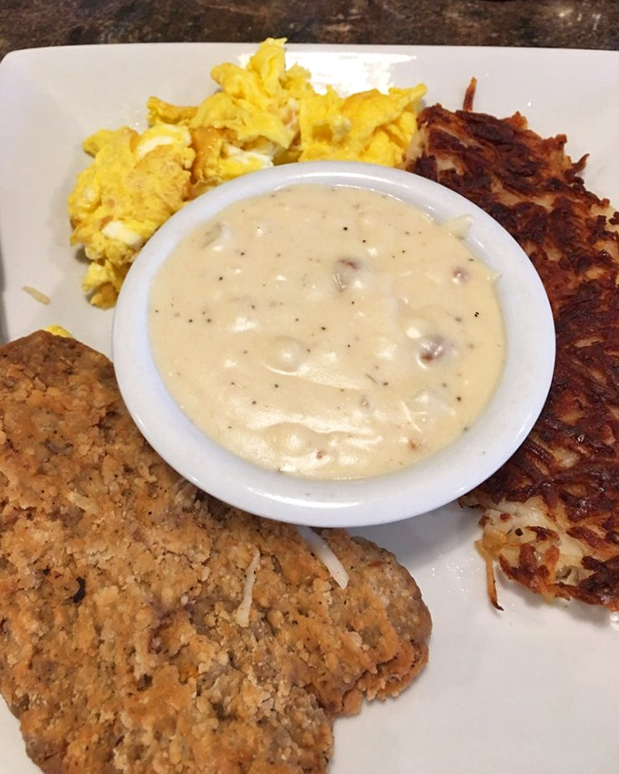 A breakfast symphony on a plate&mdash;country gravy, crispy hash browns, fluffy eggs, and a biscuit that deserves its own fan club.