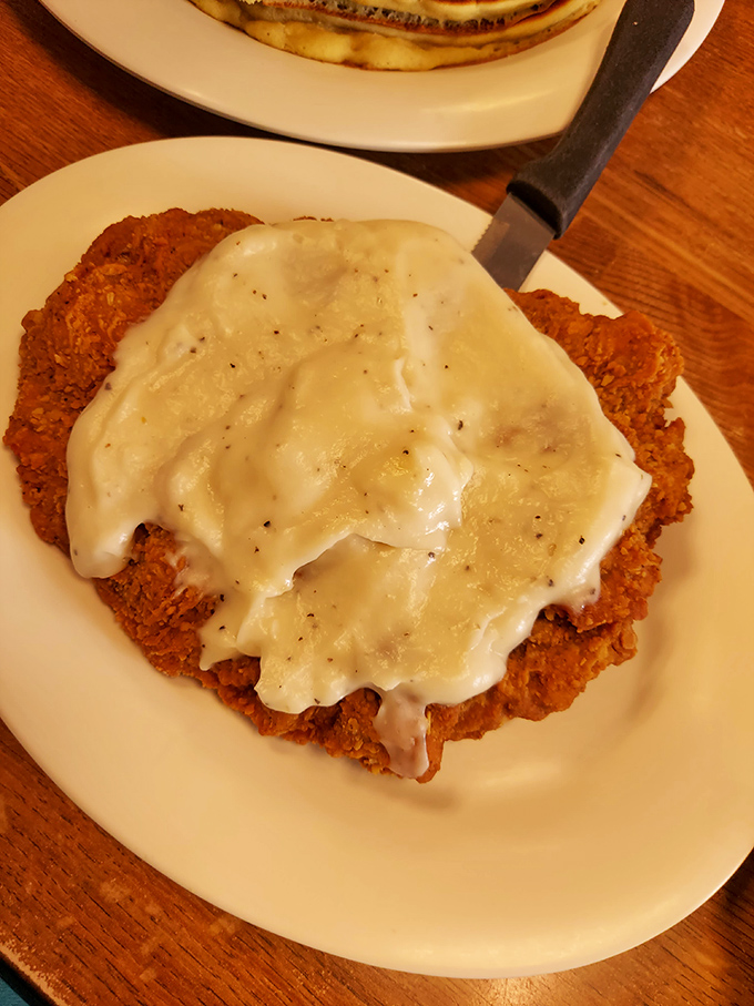 Chicken fried steak smothered in creamy gravy &ndash; where Southern comfort meets Virginia Beach in a dish that hugs your soul from the inside.
