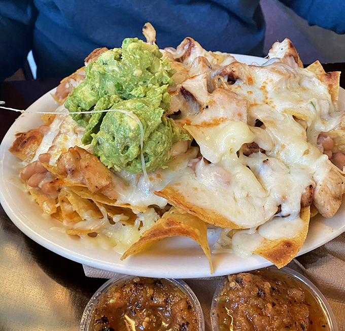 Chicken nachos that solve the eternal problem: every chip gets its fair share of toppings. No sad, naked chips hiding at the bottom here!