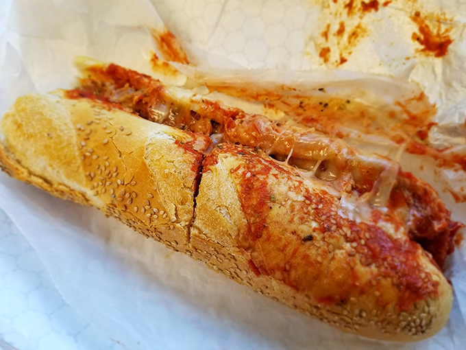 The chicken parm sandwich, where marinara meets melty cheese on a sesame-seeded roll. Italy and Philly having a delicious conversation.