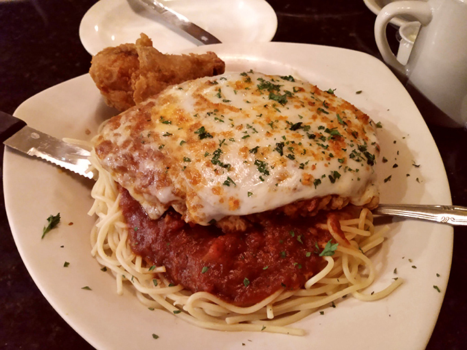 This chicken parmesan isn't messing around. That cheese pull could win Olympic medals, and the pasta beneath is ready for its supporting actor award.