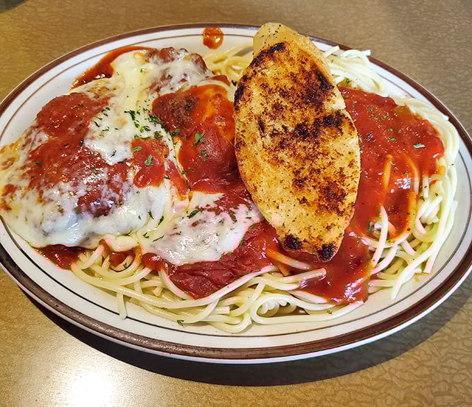 Spaghetti, sauce, cheese, and garlic bread&mdash;this chicken parmesan isn't trying to reinvent Italian-American cuisine, it's just perfecting it.