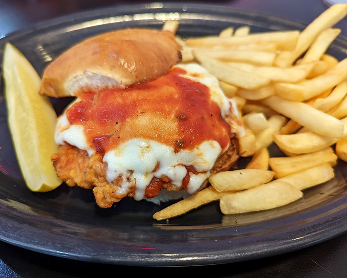 The Chicken Parmesan Sandwich&mdash;where Italian tradition meets American diner ingenuity. Crispy, saucy, cheesy perfection with a side of golden fries.