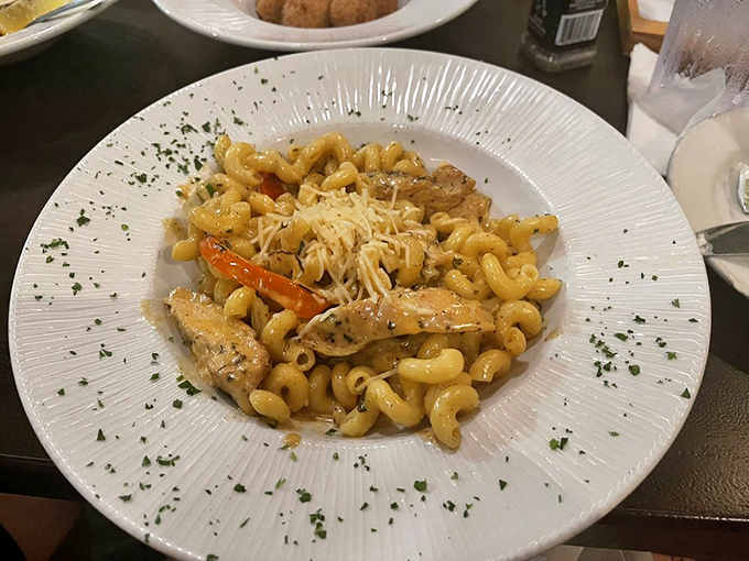 Pasta perfection with a coastal twist &ndash; tender cavatappi cradles succulent shrimp and chicken in a sauce worth sopping up with every last bread crumb.