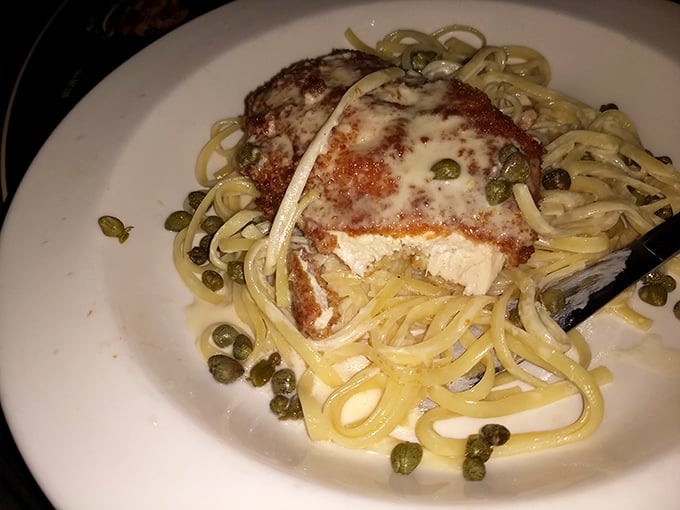 Not just burgers here—this chicken piccata with capers and pasta proves Johnny's kitchen knows its way around Italian classics too.