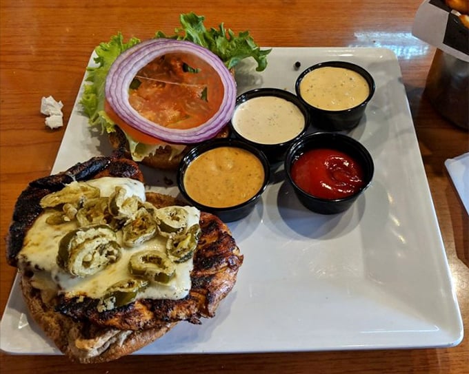 This isn't just a chicken sandwich; it's a masterclass in toppings with jalape&ntilde;os, melted cheese, and a lineup of sauces that deserve their own fan club.