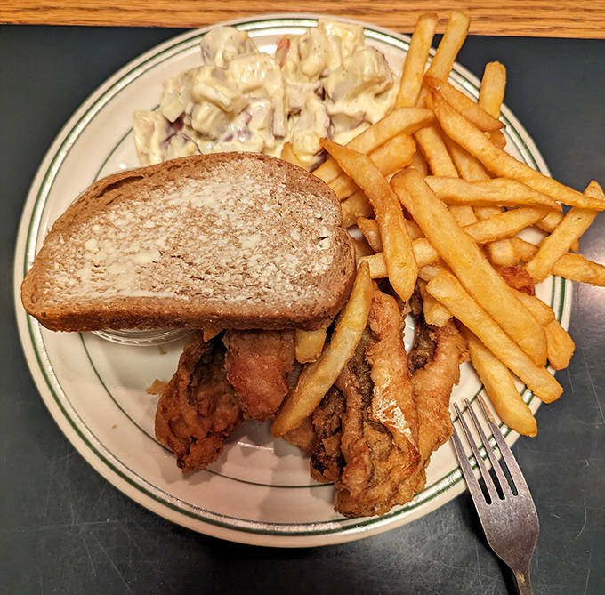 This isn't just a sandwich; it's a Midwest masterpiece with crispy chicken, creamy coleslaw, and fries that deserve their own fan club.