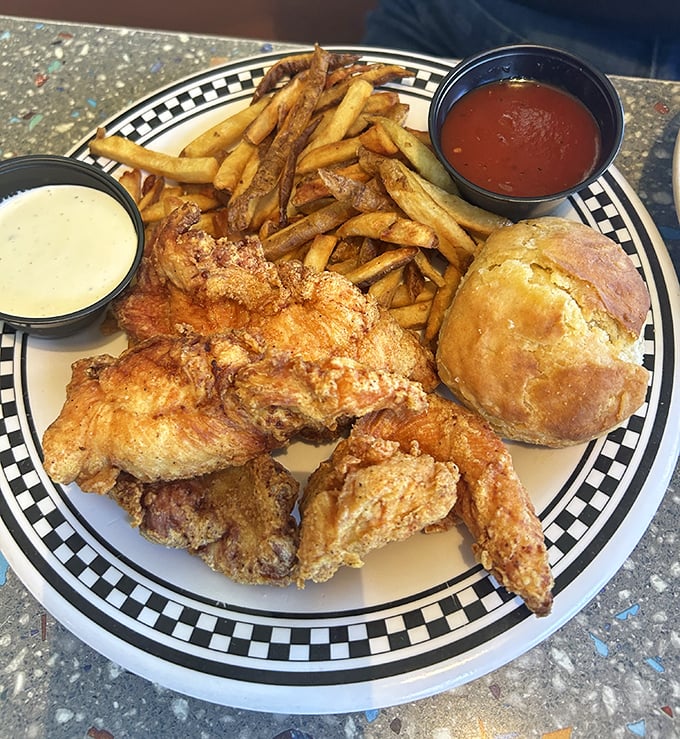 Fried chicken that would make your grandmother jealous, served with crispy fries and a roll that's begging to sop up every last drop of sauce.