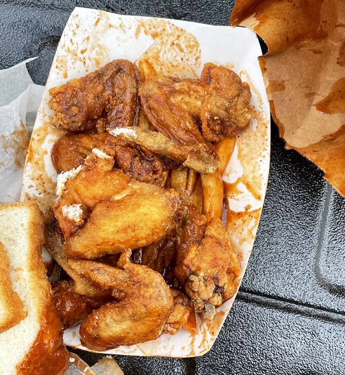 Golden-fried wings and sauce-drenched tips share space in perfect harmony&mdash;like a delicious jazz duet on a paper plate.