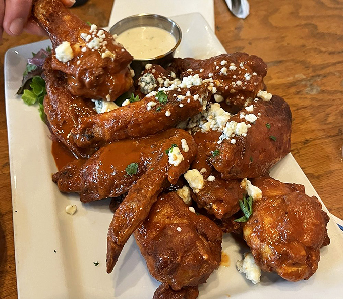 Blue cheese crumbles add a tangy punch to these wings, which aren't just finger-licking good&mdash;they're worth-licking-your-neighbor's-fingers good. (Don't actually do that.)
