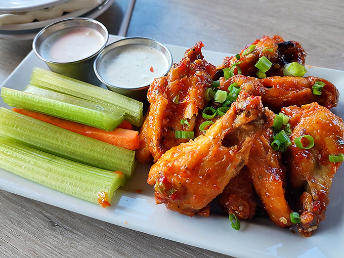 These chicken wings look like they could solve world peace, one perfectly sauced bite at a time.