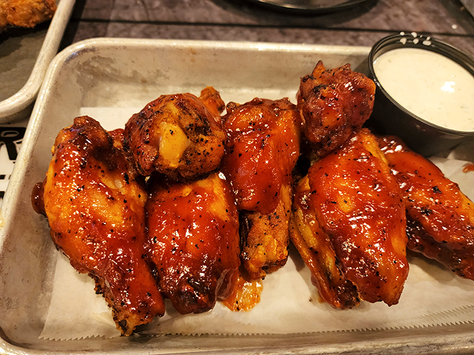 These aren't just wings; they're sticky-fingered proof that napkins were a brilliant invention. Glazed with sauce that balances sweet and heat like a culinary tightrope walker.