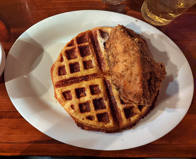 The chicken and waffle alliance continues its delicious diplomacy here&mdash;crispy, golden-brown chicken making peace with a fluffy, butter-kissed waffle on neutral territory.