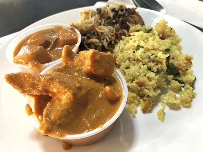 Three curries, infinite possibilities. This trio of copper bowls contains more flavor than most restaurants manage in their entire menu.