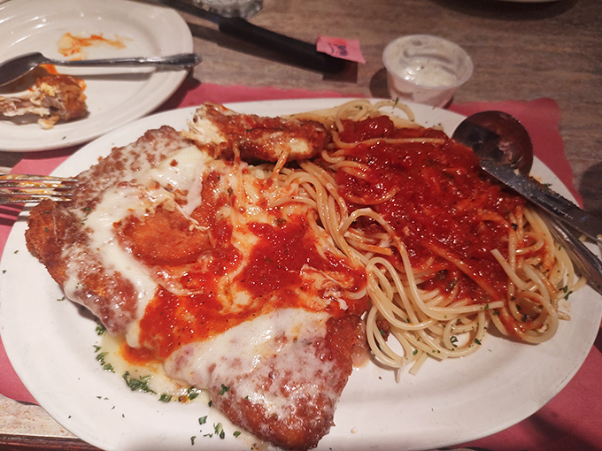This isn't just chicken parmesan; it's a love letter to Italian-American cuisine with enough sauce and cheese to make your cardiologist wince.