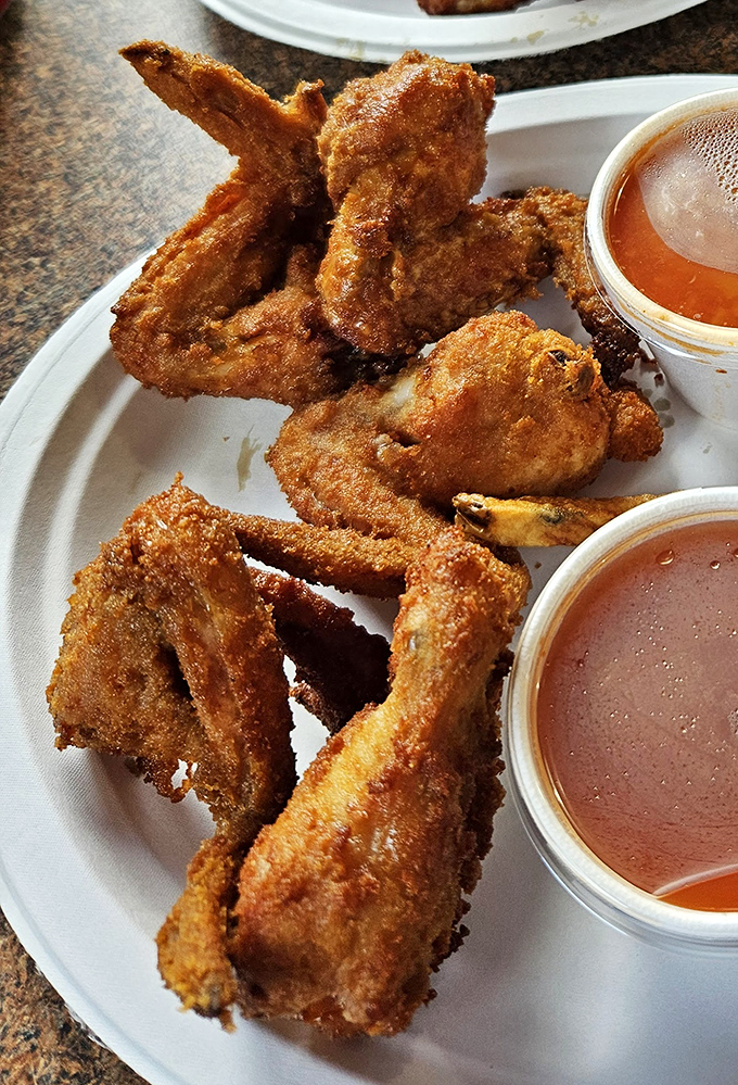 These wings aren't just fried, they're transformed. Paired with that signature hot sauce, they're the reason napkins were invented.