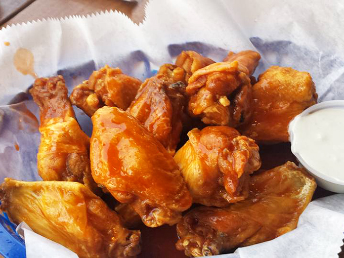 Wings that could make Buffalo, NY residents consider relocating to Florida. Crispy, saucy perfection that demands both napkins and your full attention.