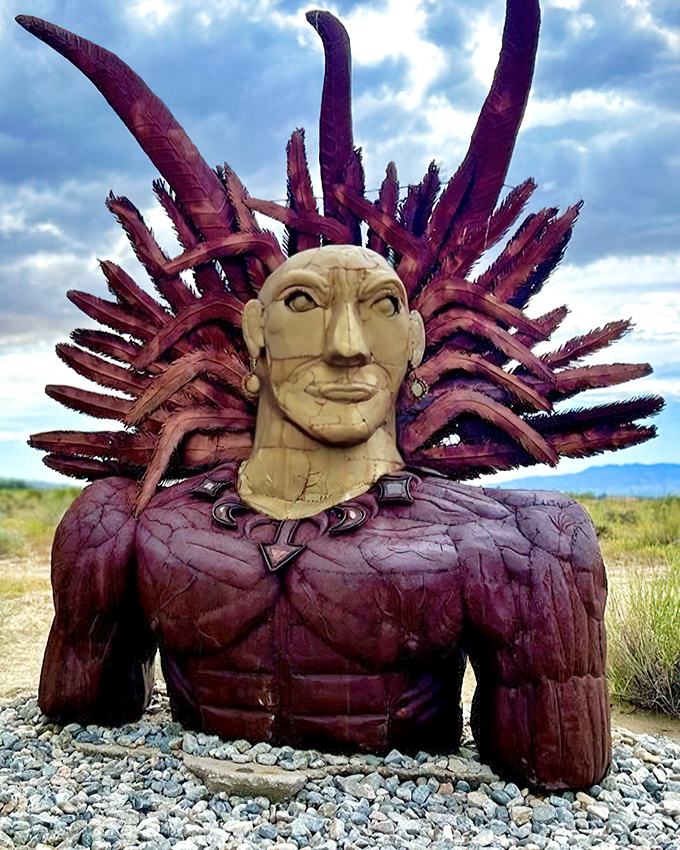 Part ancient deity, part rock star, this regal metal figure with its crown of spikes seems to survey its desert kingdom with quiet dignity.