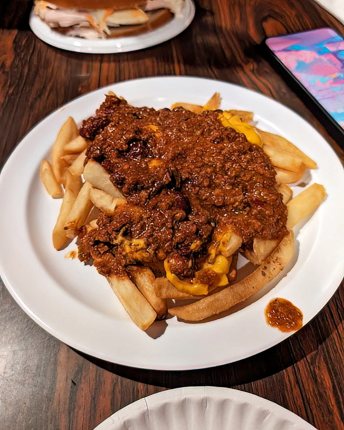 Chili cheese fries that don't apologize for being exactly what they are: a glorious, messy indulgence that renders napkins essential and diets optional.